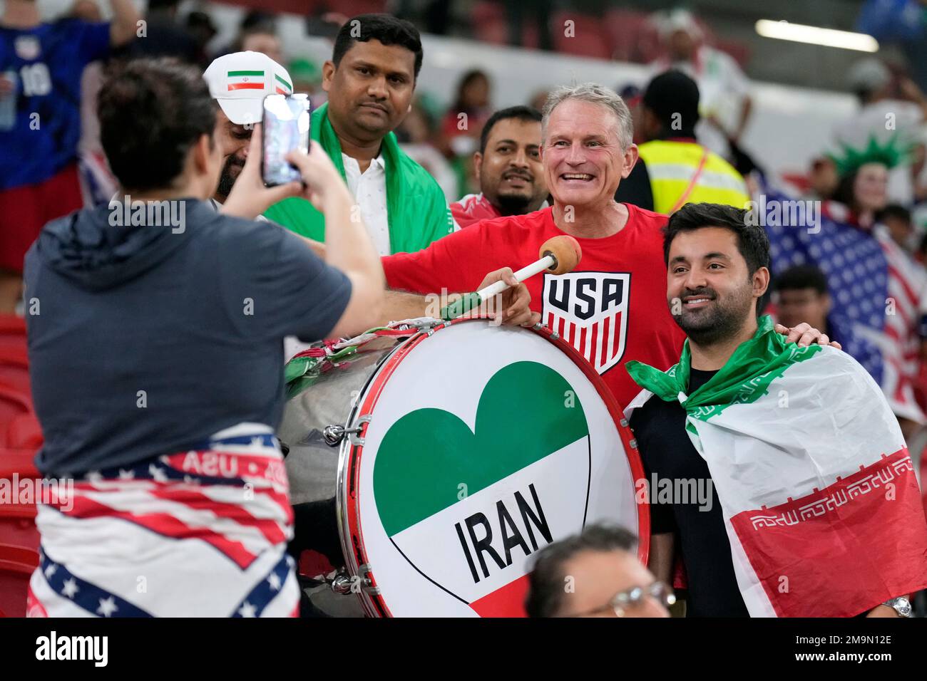 Iranian and United States soccer fans pose for a photo before the World ...