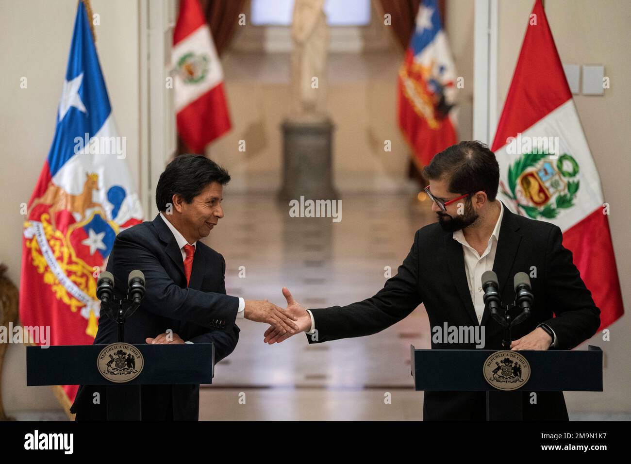 Perus President Pedro Castillo Left Shakes Hands With Chilean