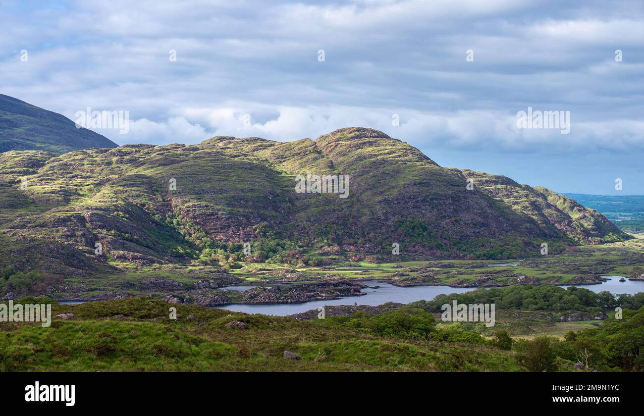 Clouds and green mountains with lakes, amazing nature of Ireland in ...