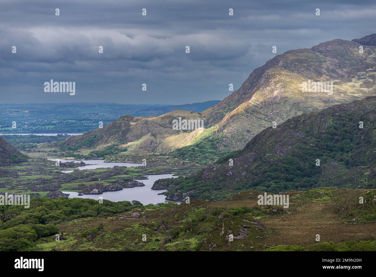 Clouds and green mountains with lakes, amazing nature of Ireland in ...