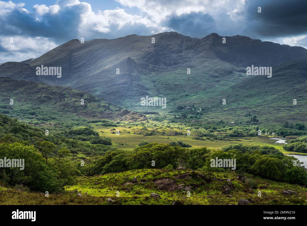 Clouds and green mountains with lakes, amazing nature of Ireland in ...