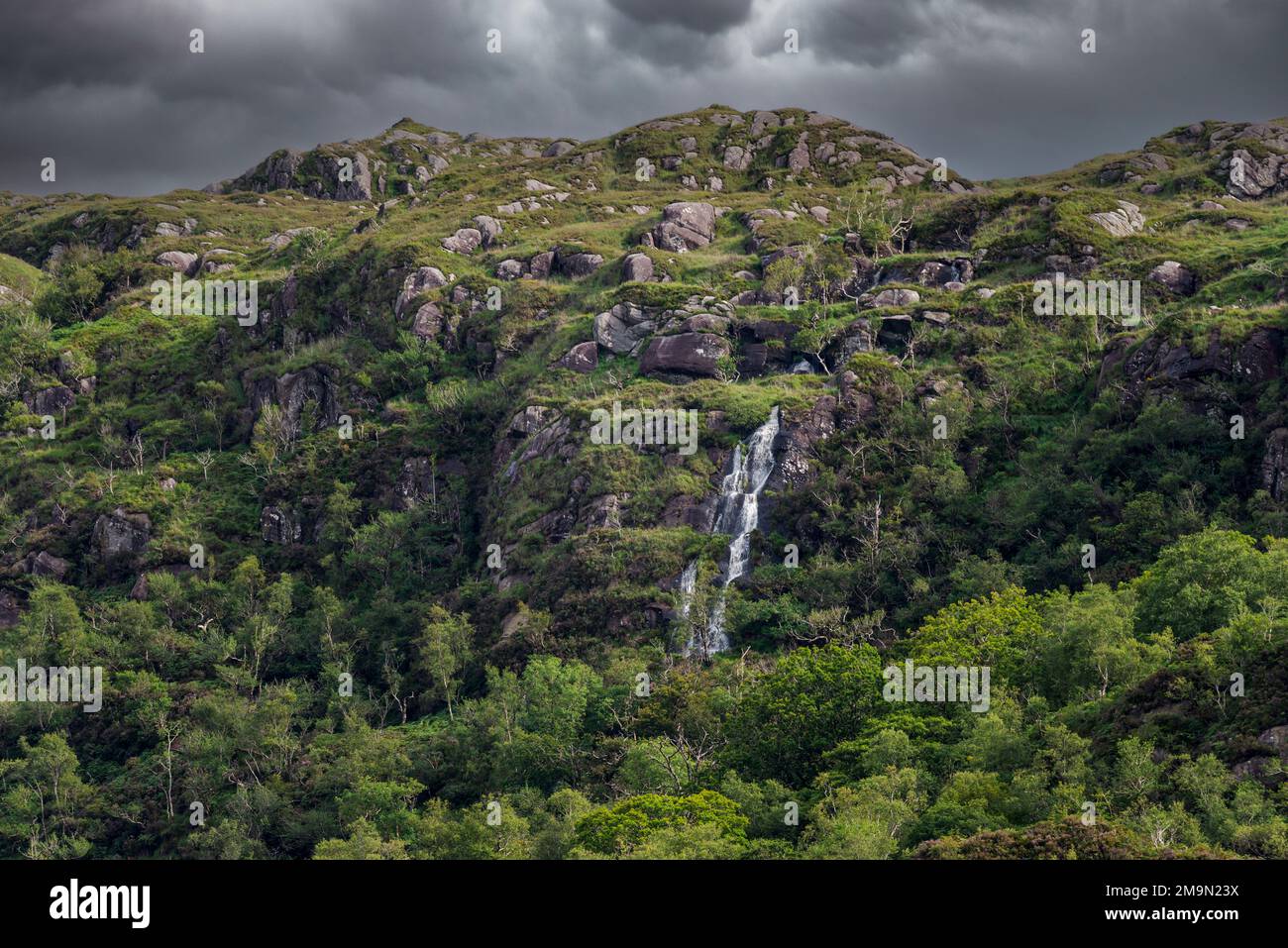 Clouds and green mountains with lakes, amazing nature of Ireland in ...
