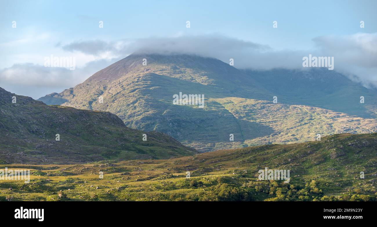 Clouds and green mountains with lakes, amazing nature of Ireland in ...