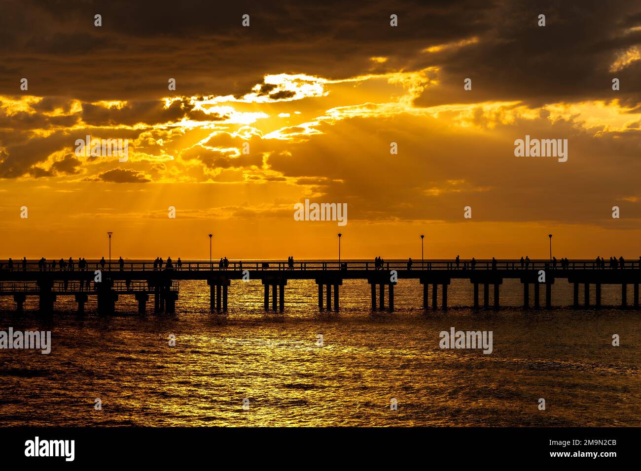 The magnificent historic Palanga Bridge on the Baltic Sea at sunset in ...