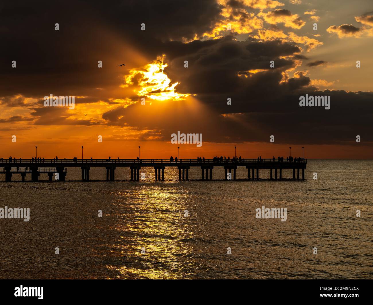 The magnificent historic Palanga Bridge on the Baltic Sea at sunset in ...