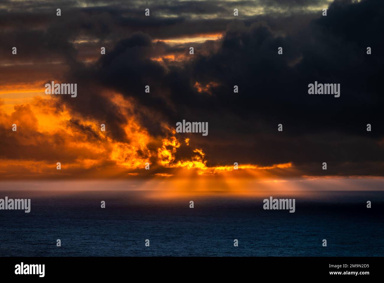 Amazing cloudy skies over the Atlantic Ocean at sunset Stock Photo - Alamy