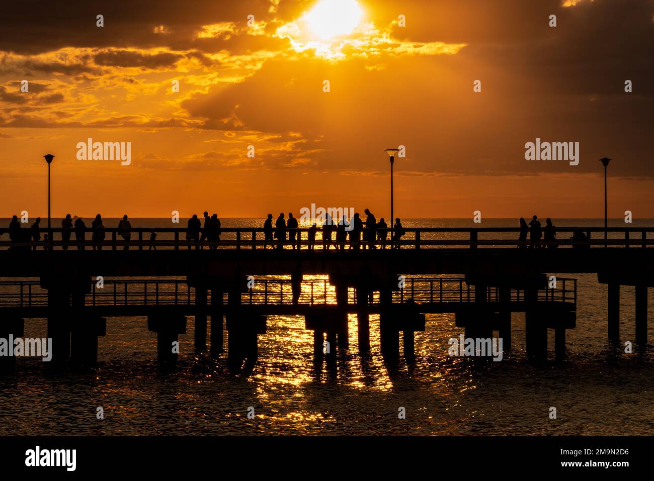 The magnificent historic Palanga Bridge on the Baltic Sea at sunset in ...