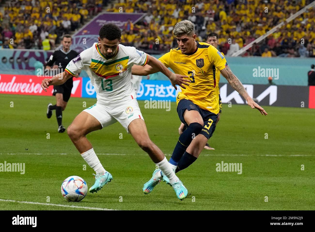 Senegal's Ismail Jakobs, left, and Ecuador's Piero Hincapie fight for ...