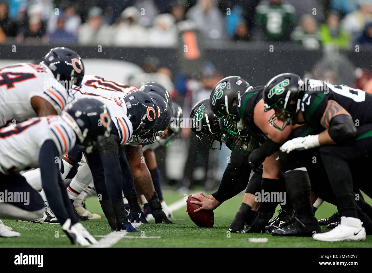 The Chicago Bears and the New York Jets line up at the line of ...