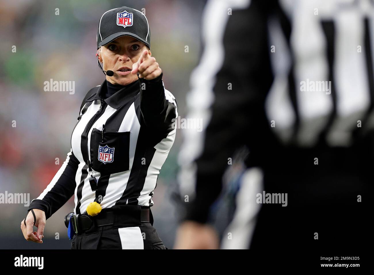 Down judge Robin DeLorenzo (134) gestures during an NFL football game ...