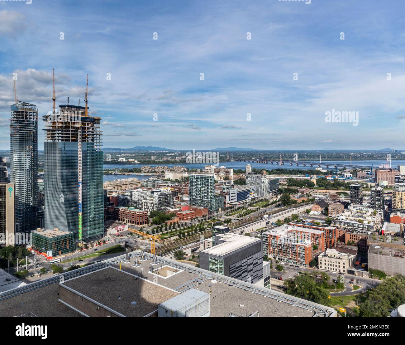 An aerial view of Montreal with Habitat 67 and the Victoria Bridge in ...