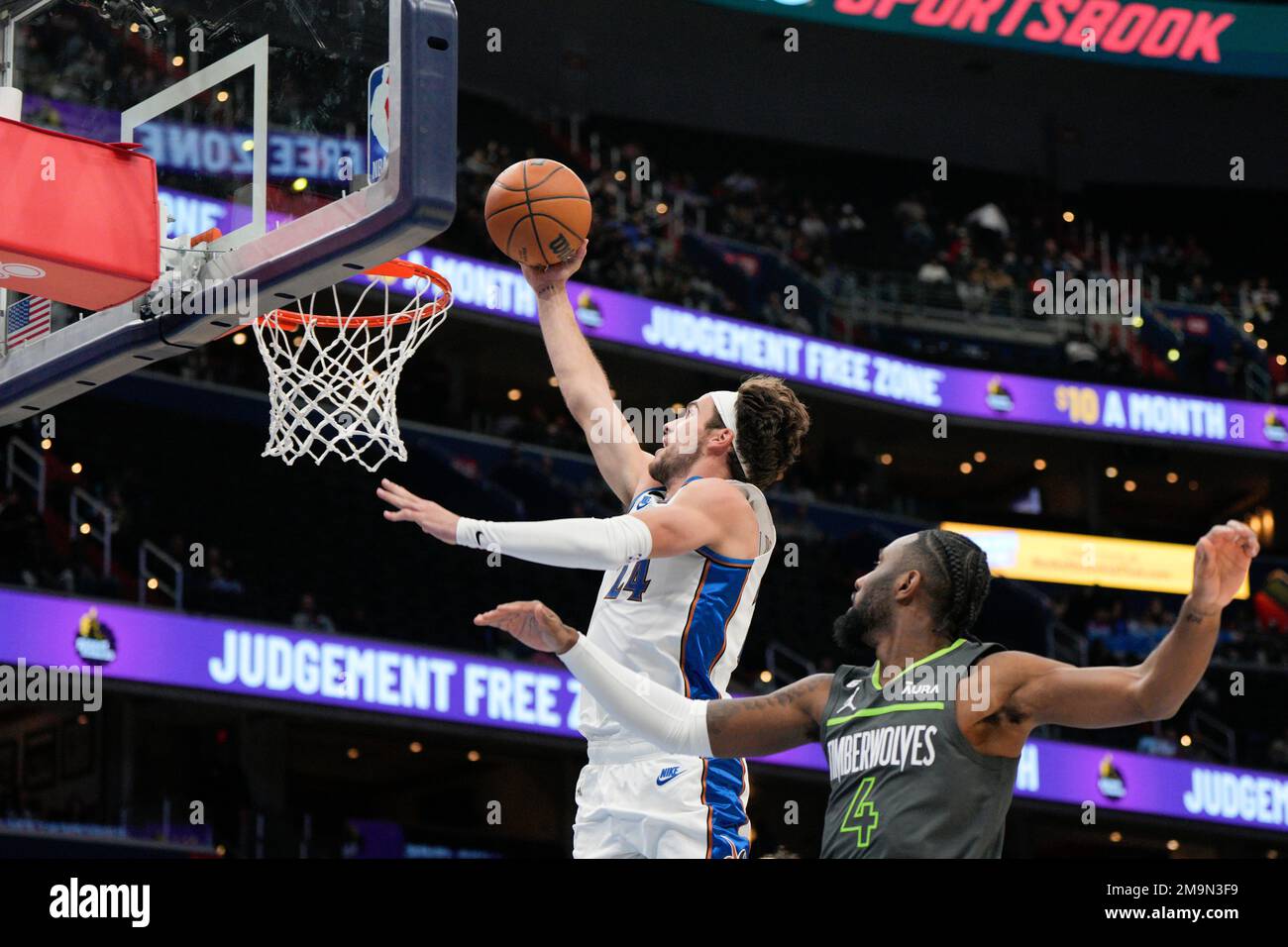 Washington Wizards forward Corey Kispert (24) scores against Minnesota ...