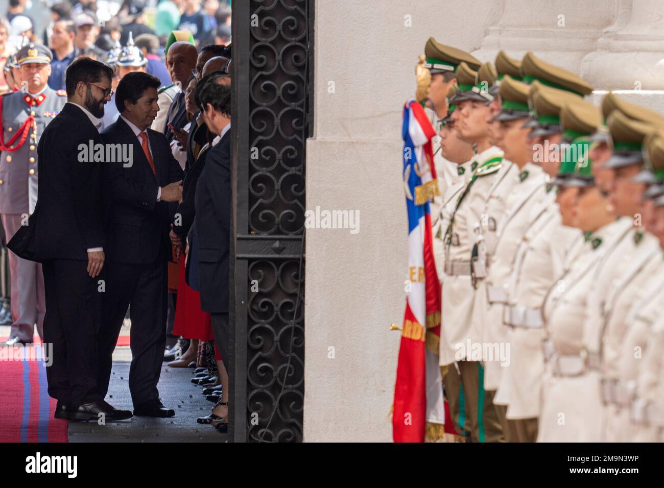 Peru's President Pedro Castillo shakes hand with Chilean ministers next ...