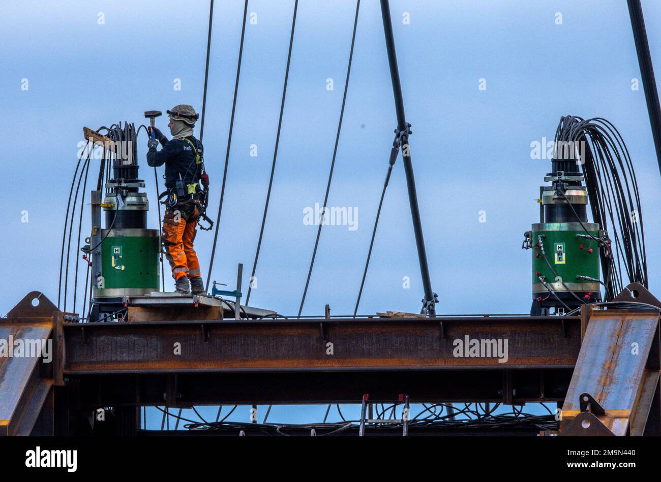 Sassnitz, Germany. 18th Jan, 2023. A fitter prepares to lower the new ...