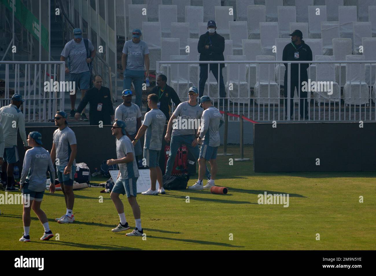 Police officers, right back, stand guard as players of England cricket ...