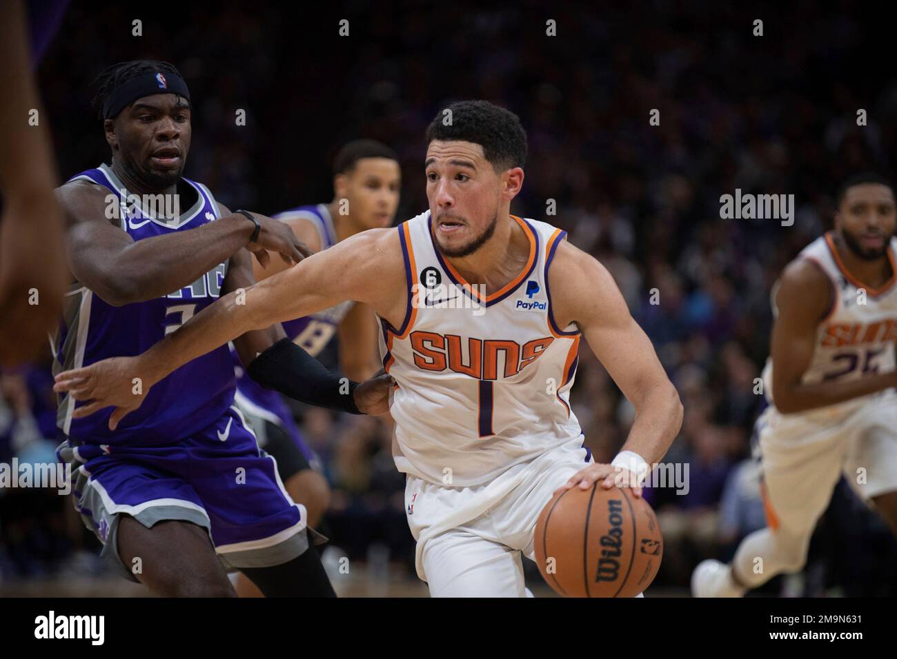 Phoenix Suns guard Devin Booker (1) gets past Sacramento Kings guard Terence Davis (3) in the ...