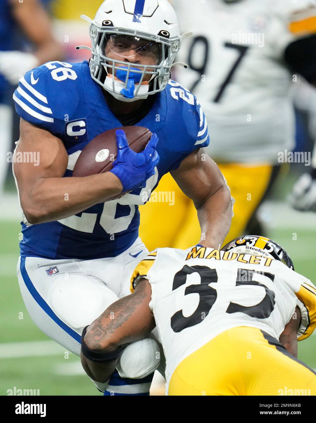 Indianapolis Colts' Jonathan Taylor (28) is tackled by Pittsburgh Steelers' Arthur Maulet (35 ...
