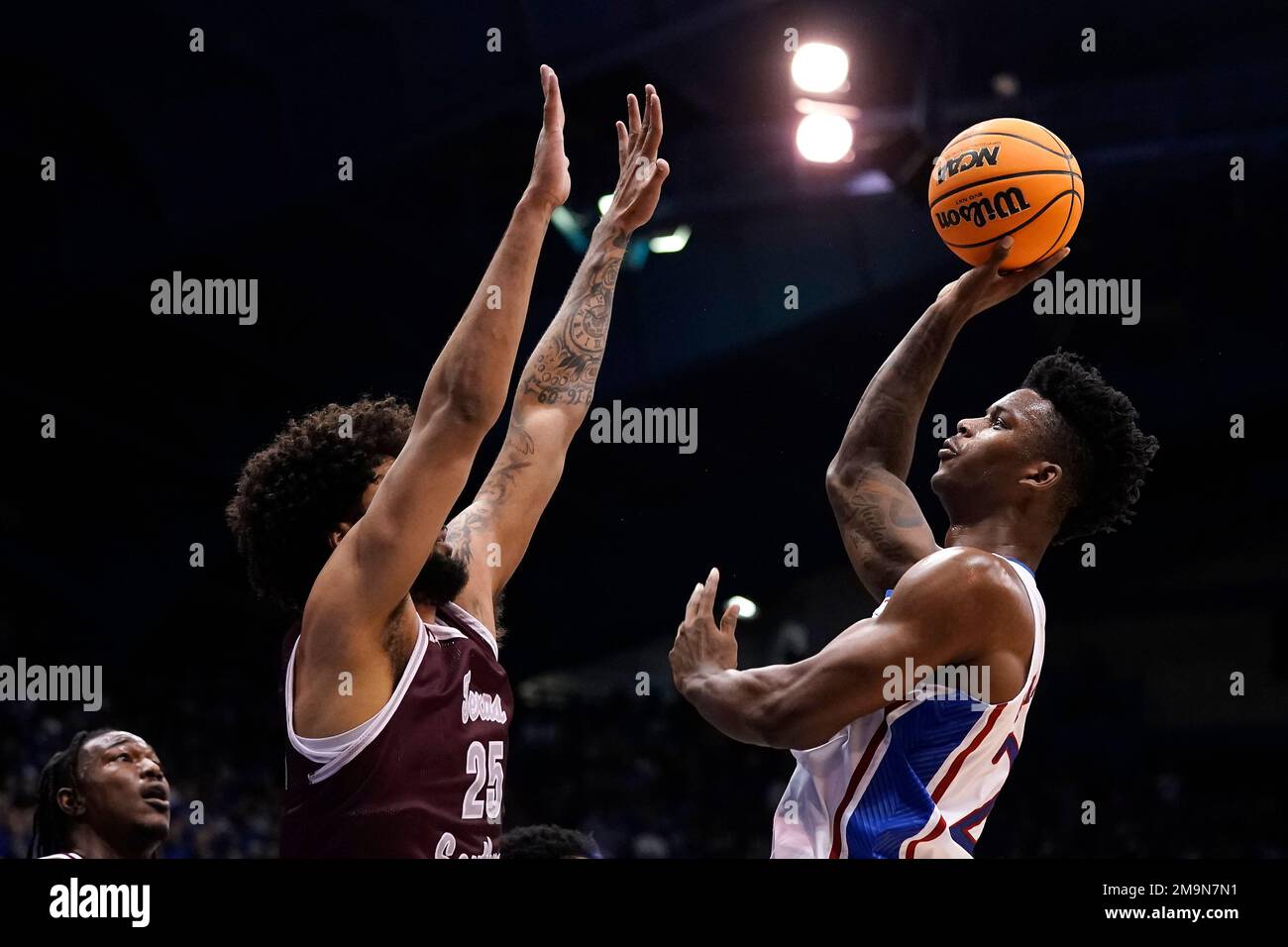 Kansas forward K.J. Adams Jr., right, shoots over Texas Southern ...