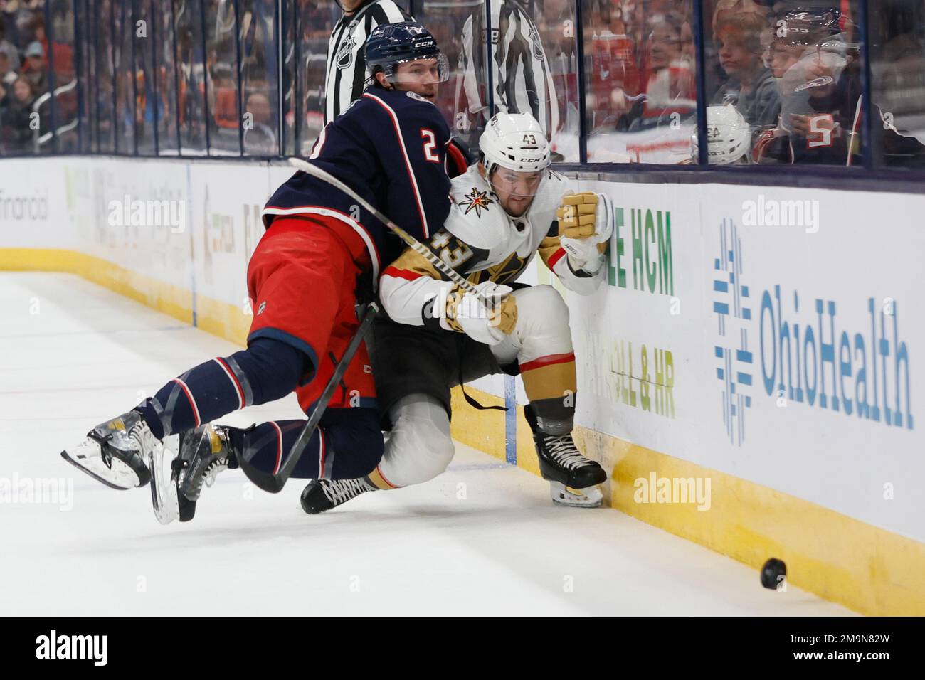 Columbus Blue Jackets' Andrew Peeke, left, checks Vegas Golden Knights ...