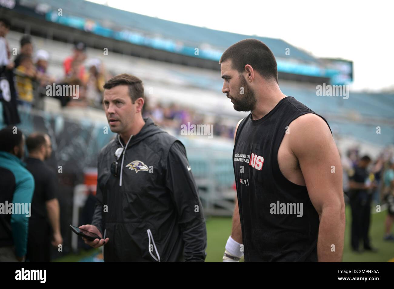 Baltimore Ravens tight end Mark Andrews, right, leaves the field before ...