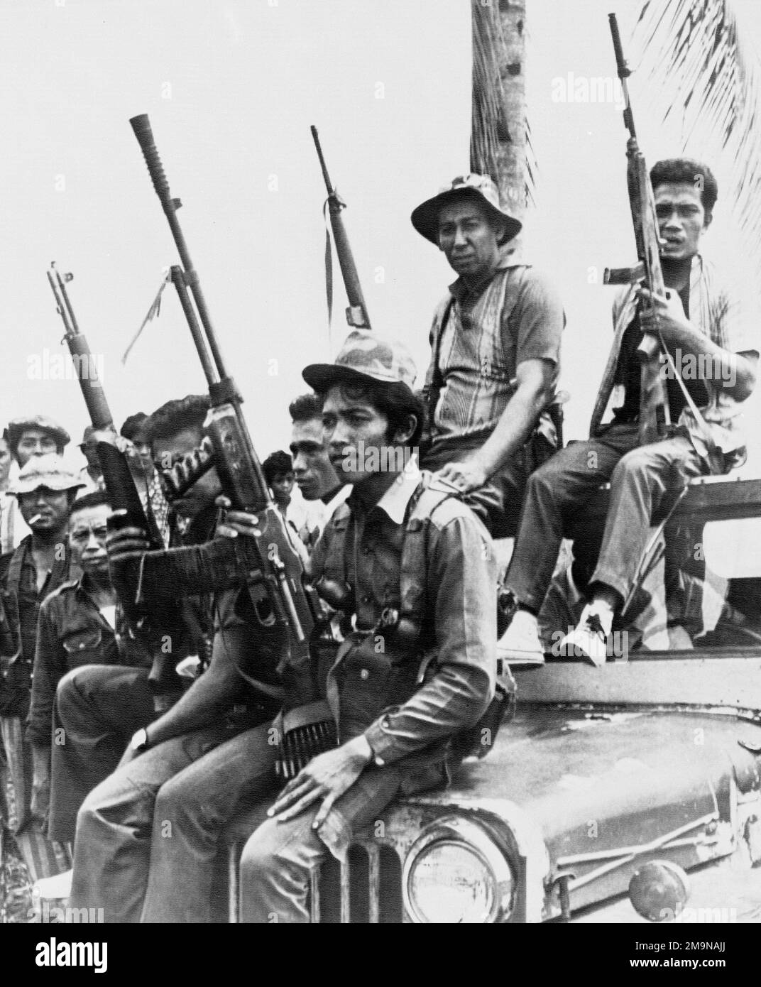 Filipino special police of the Pikit municipality sit atop a jeep with ...