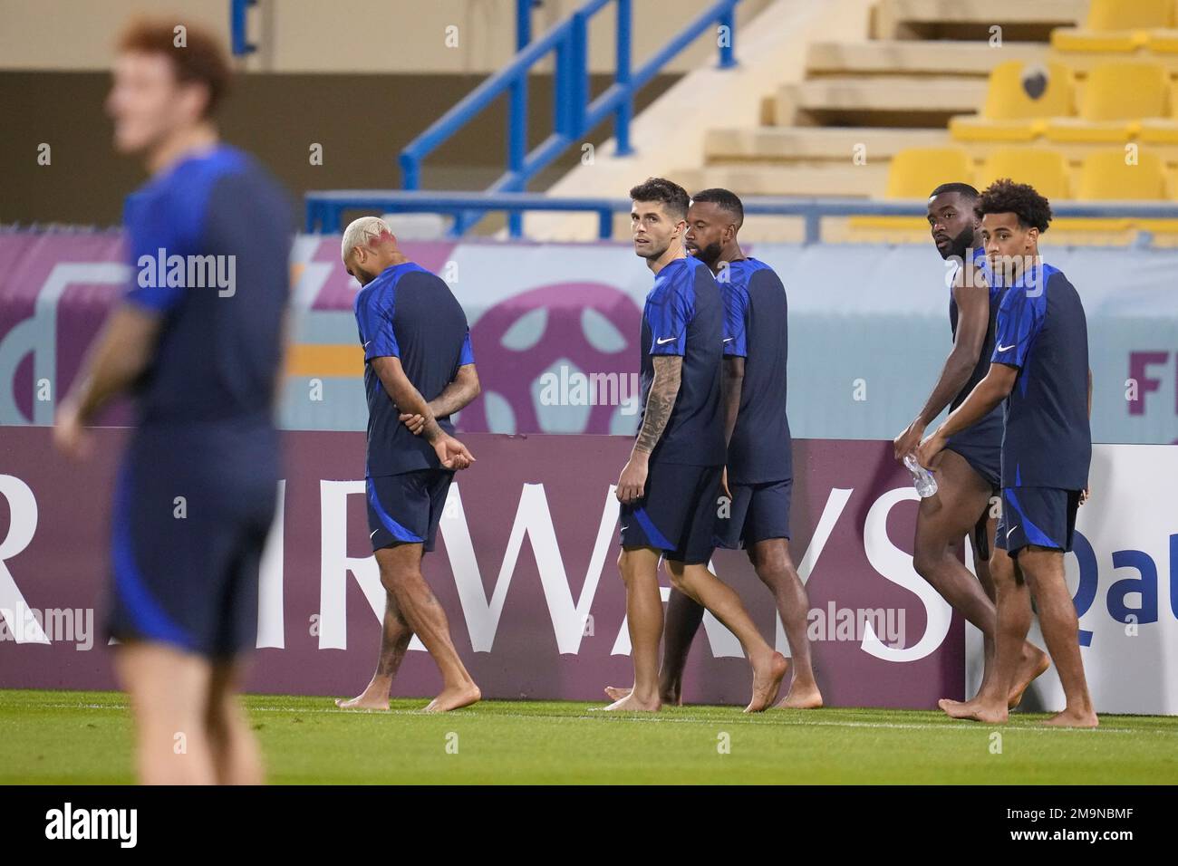 Christian Pulisic, center, of the United States, and other players walk ...