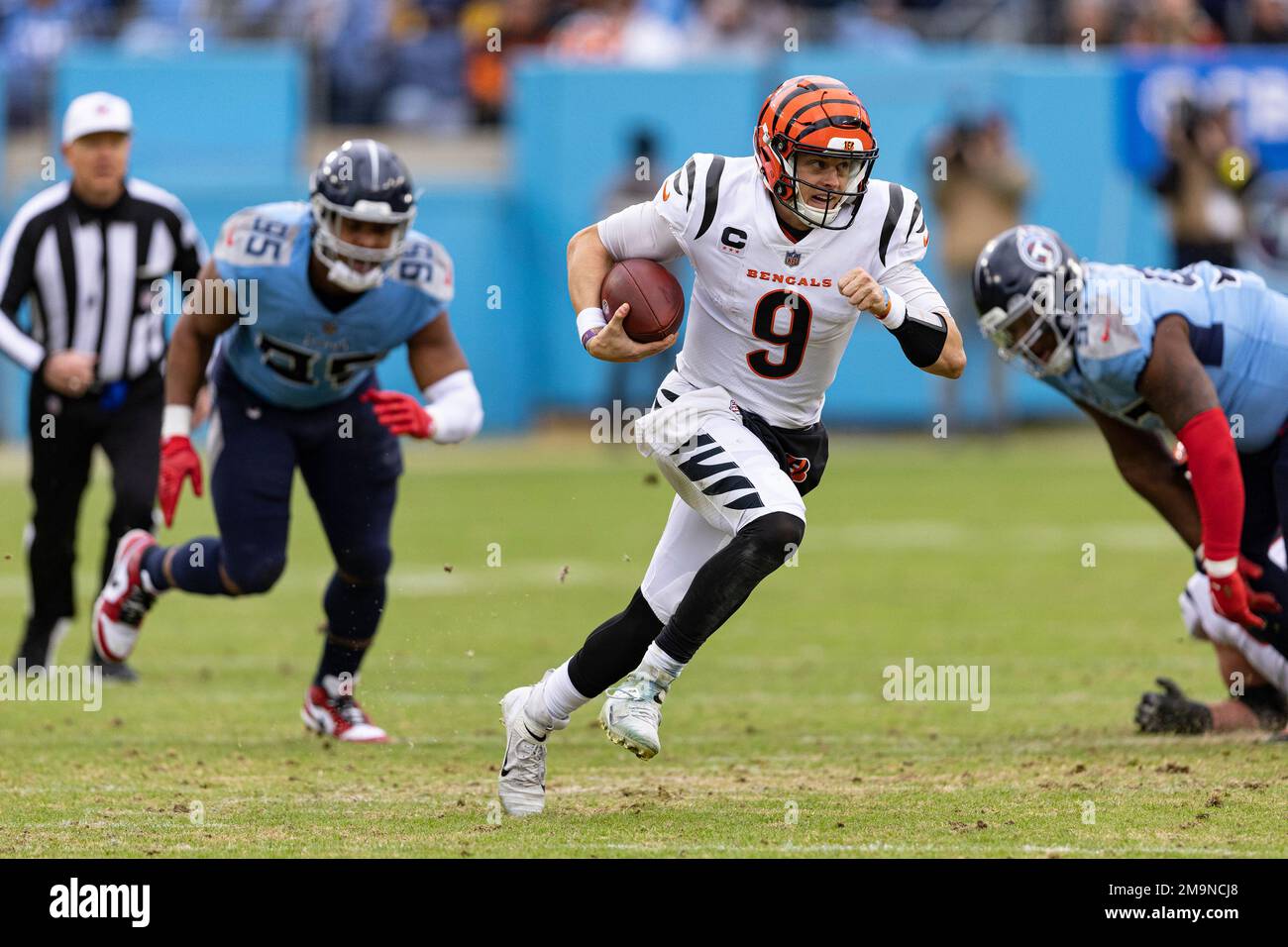 Cincinnati quarterback Joe Burrow (9) runs for yardage during their ...