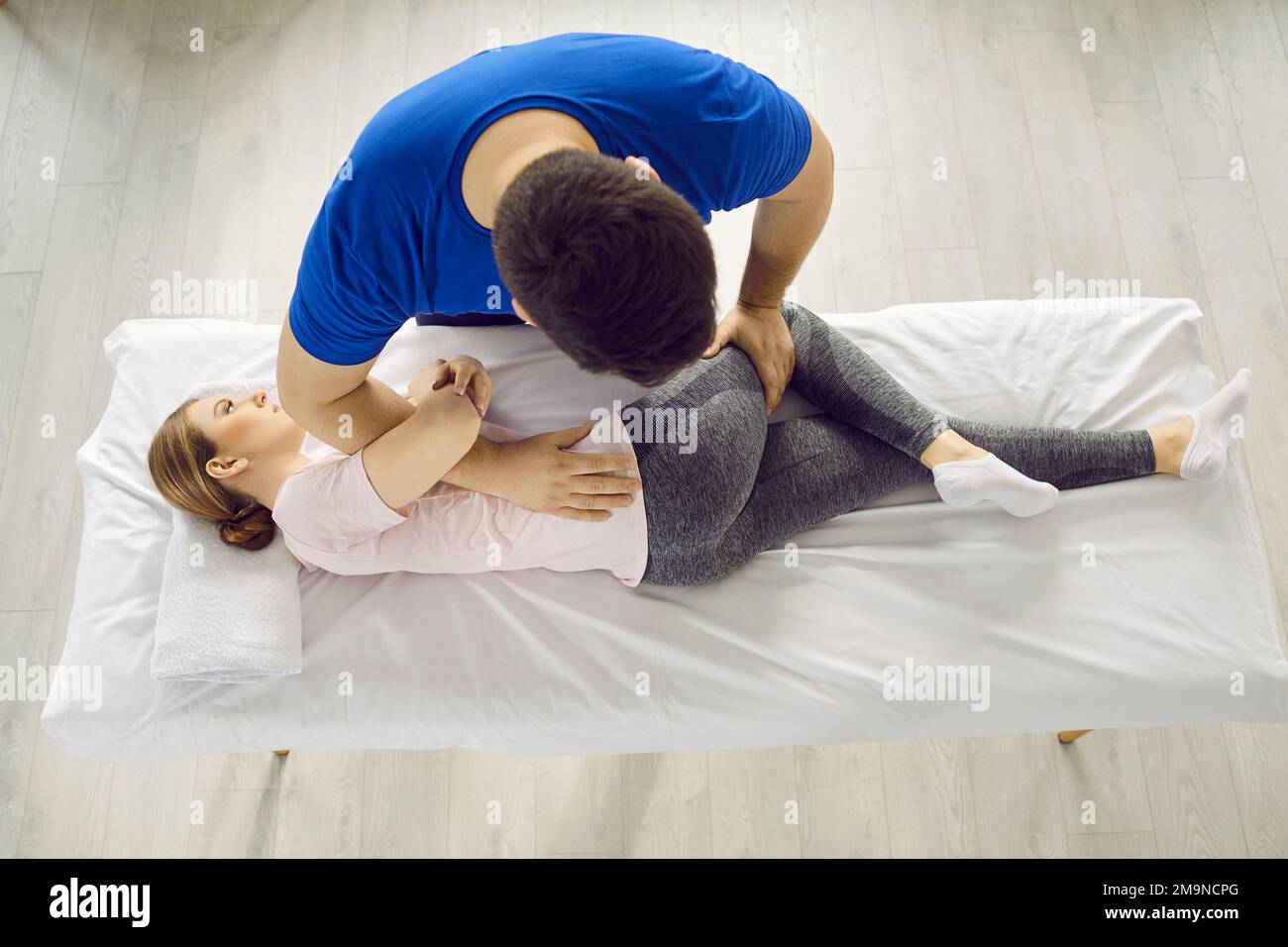 Male therapist help female patient with recovery Stock Photo - Alamy