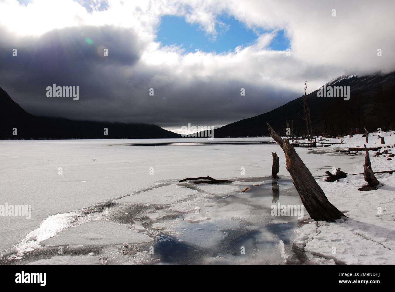 Frozen lake broken ice Stock Photo - Alamy