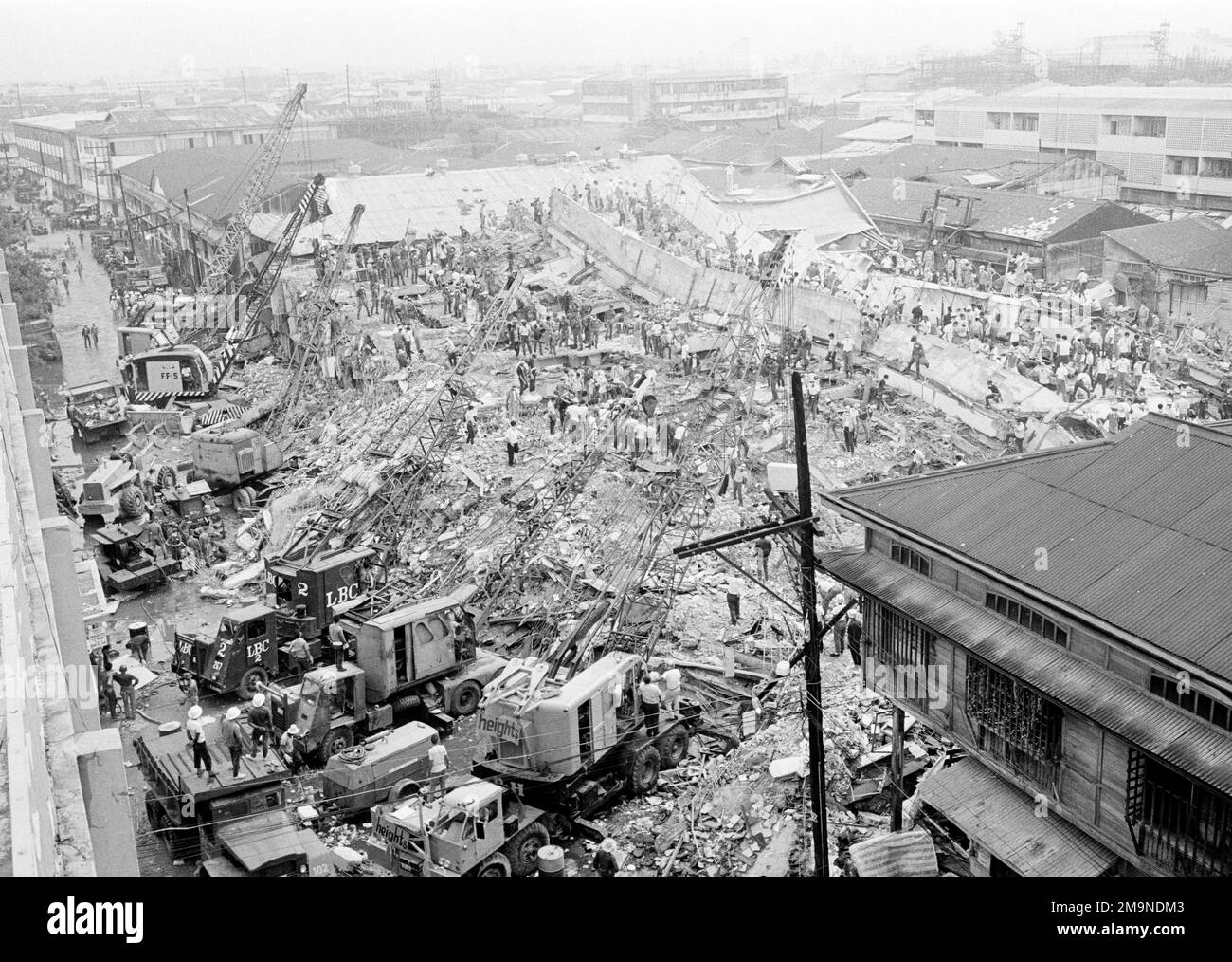 Rescue workers continue searching the wreckage for survivors in Manila ...