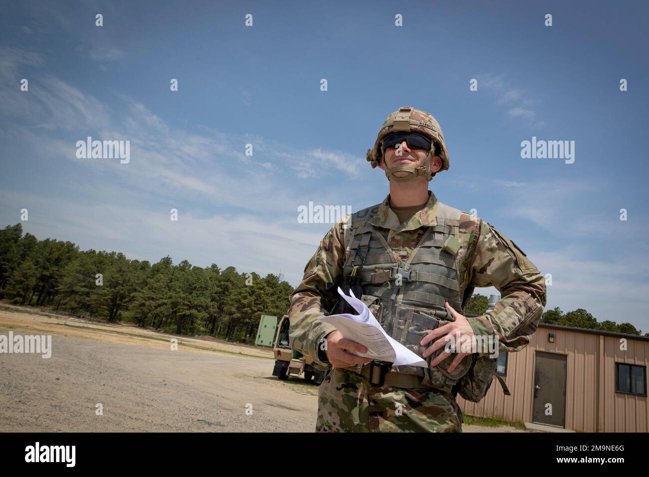 U.S. Army Maj. Jesse Barnes, S3, 112th Field Artillery Regiment, helps ...