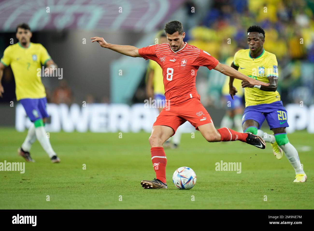 Switzerland's Remo Freuler, centre, shots the ball during the World Cup ...