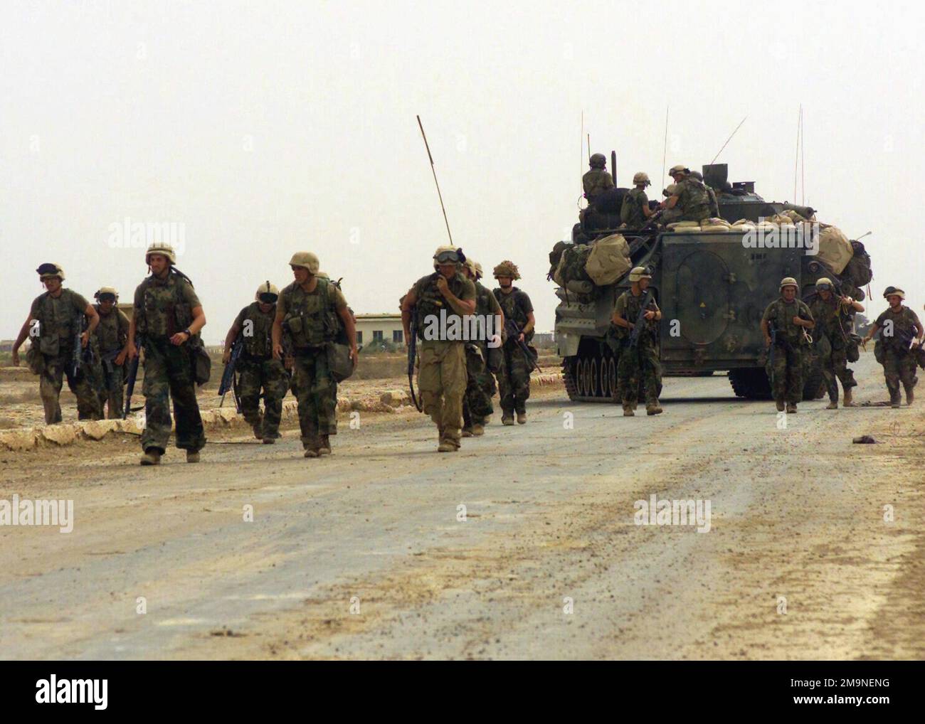 Moving out from a Light Armored Vehicle (LAV) 25, Marines from Echo ...