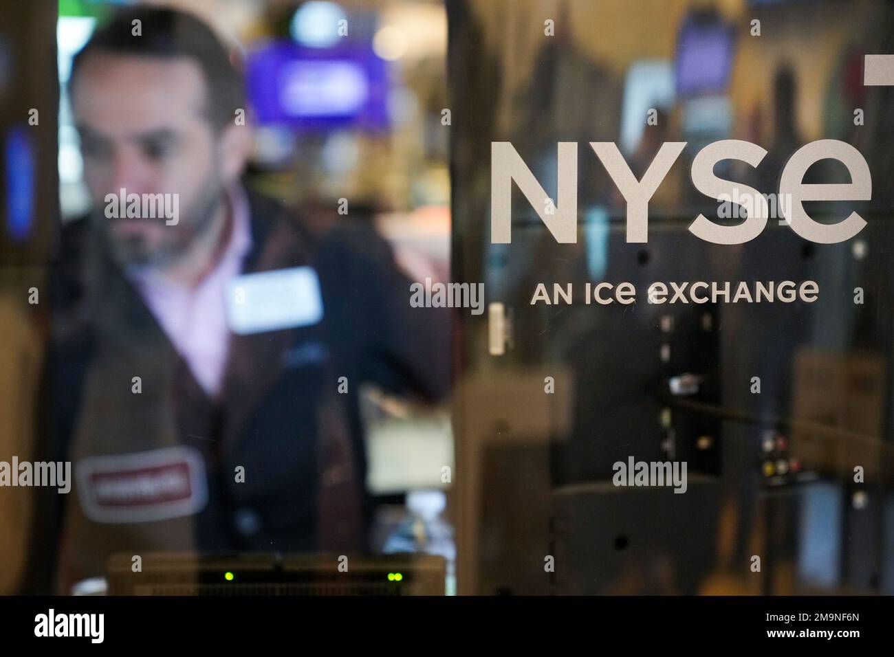 Traders work on the floor at the New York Stock Exchange in New York ...