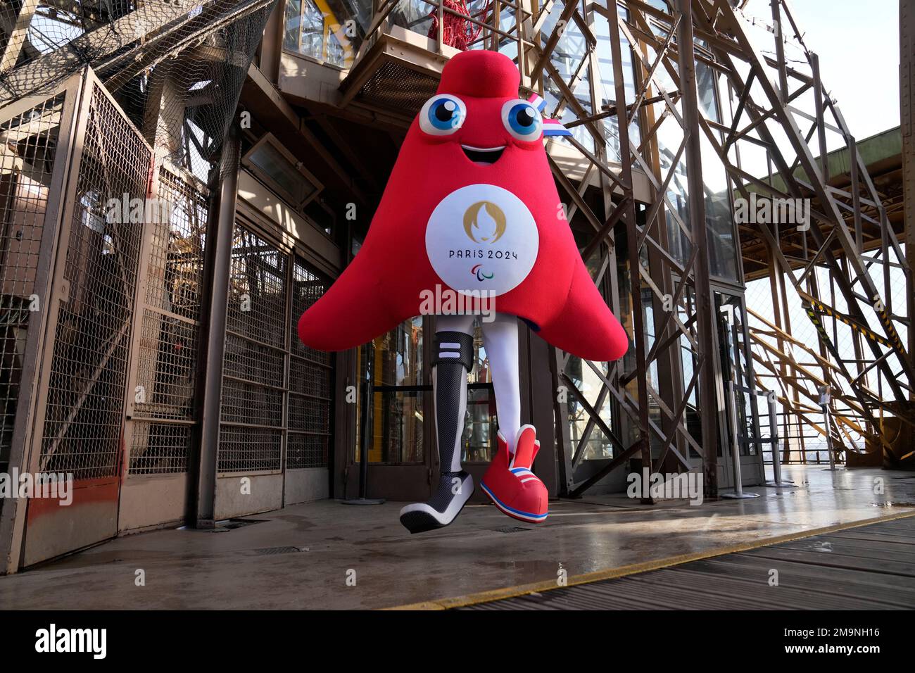 A mascot of the Paris 2024 Paralympic Games jumps at the Eiffel Tower ...