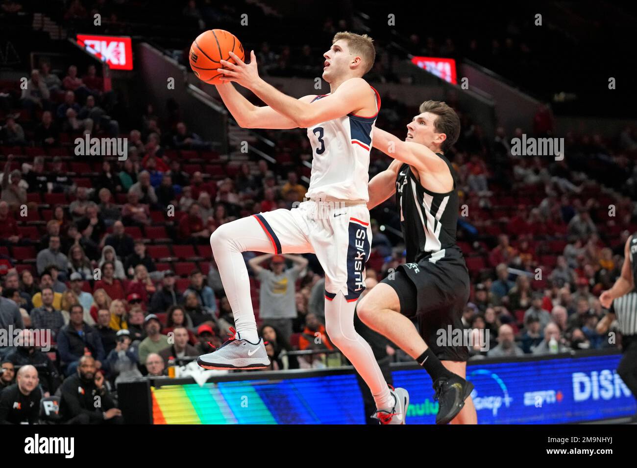 Connecticut guard Joey Calcaterra (3) goes to the basket as Iowa State ...