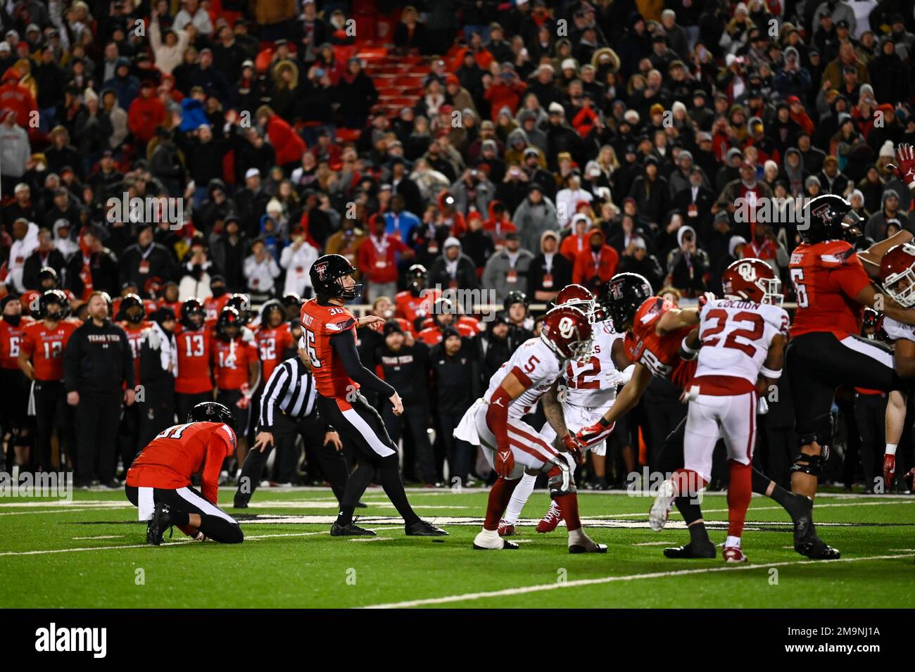 Texas Tech place kicker Trey Wolff, second from left, kicks the game ...