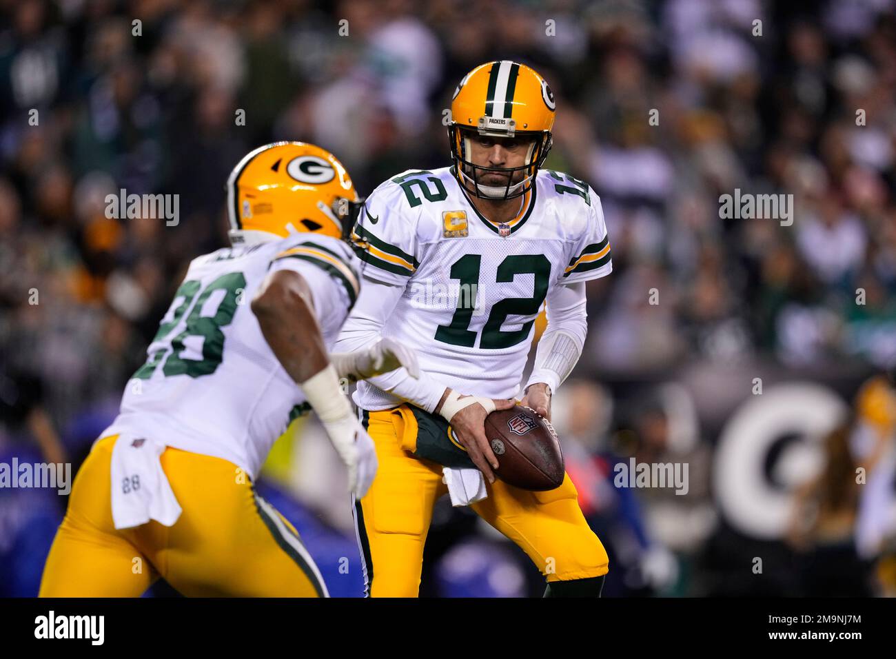 Green Bay Packers quarterback Aaron Rodgers (12) hands to AJ Dillon (28 ...