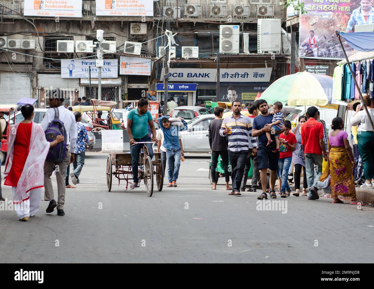 Indian people walking at the bazaar outdoor. Street market downtown ...