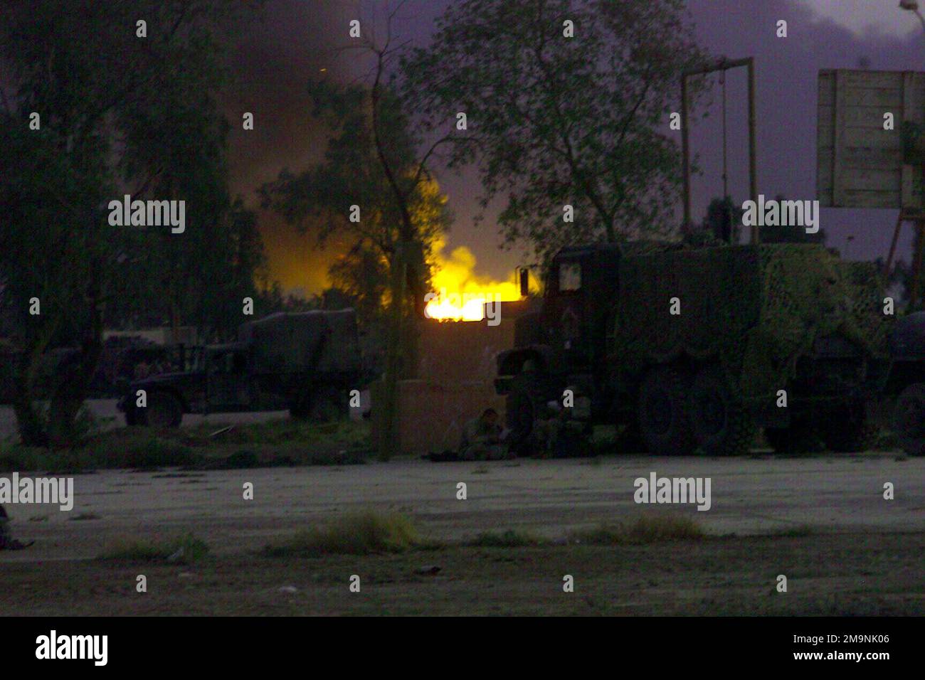 At dusk, a bond fire set by Iraqis, their way of celebrating their ...