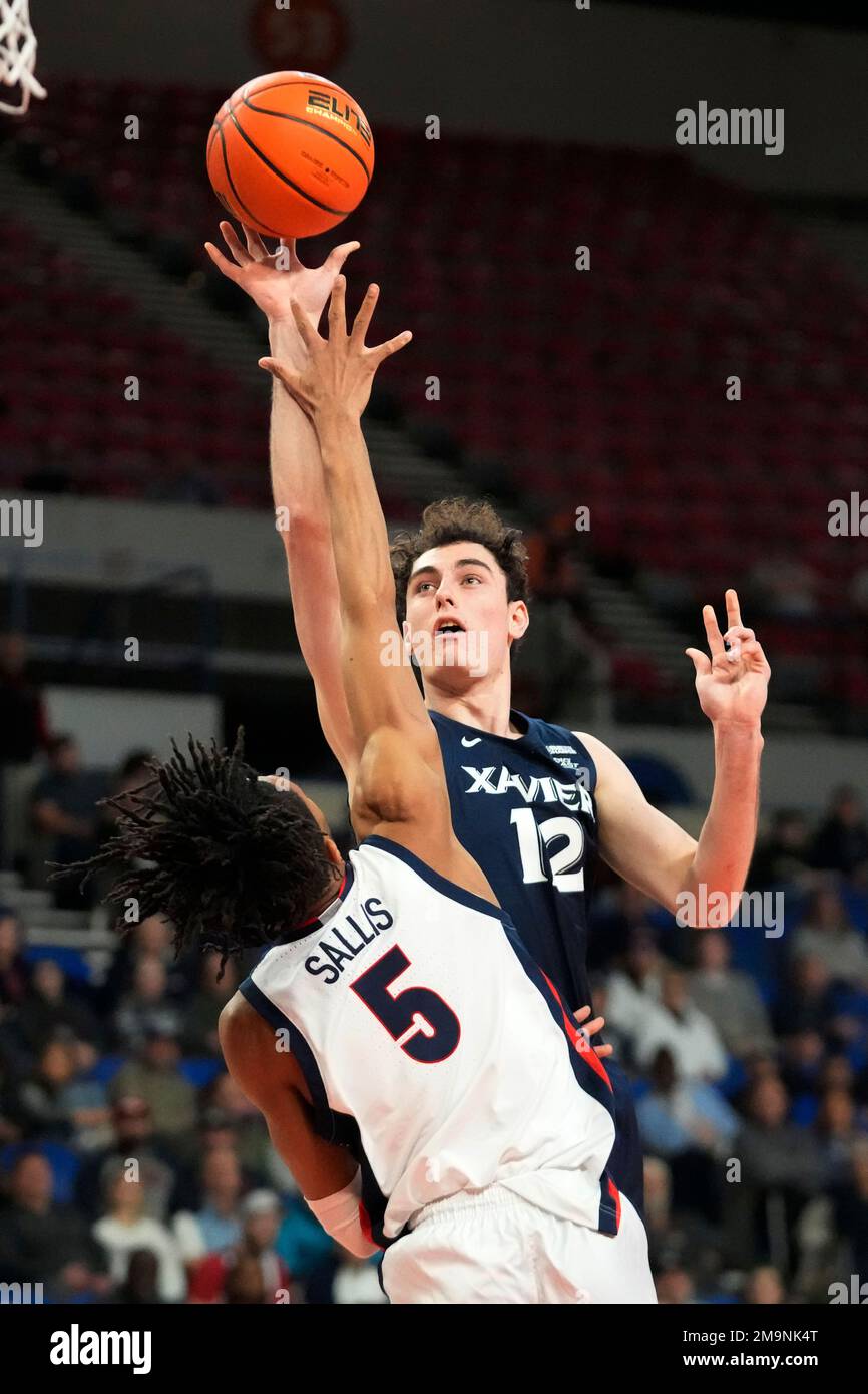 Xavier guard Kam Craft (12) shoots against Gonzaga guard Hunter Sallis ...
