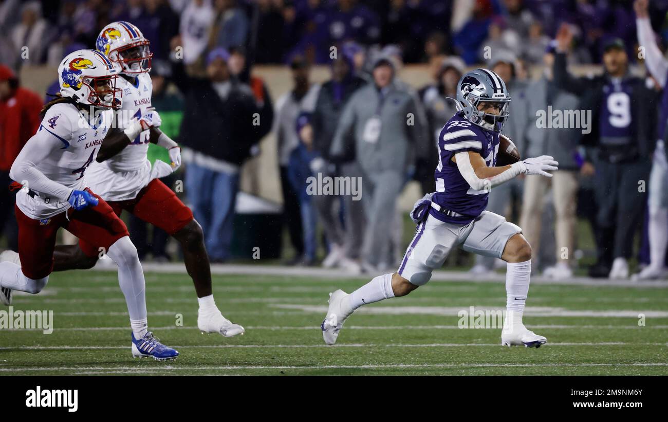 Kansas State running back Deuce Vaughn, right, rushes for a first down ...