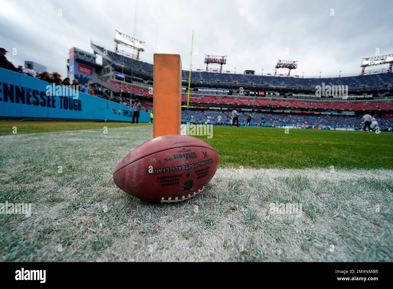 A Wilson NFL football sits next to an end zone pylon before an NFL ...
