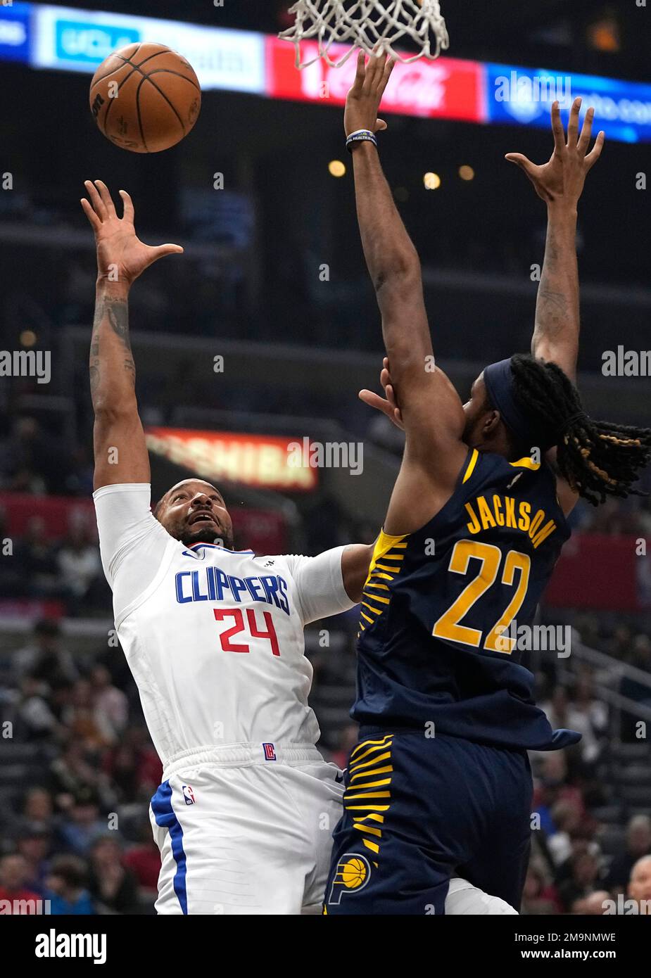 Los Angeles Clippers forward Norman Powell, left, shoots as Indiana ...