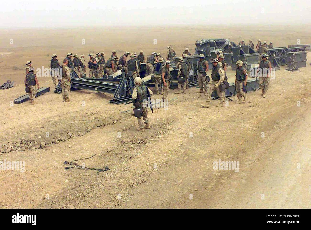US Marine Corps (USMC) personnel build a bridge along Highway One, in ...