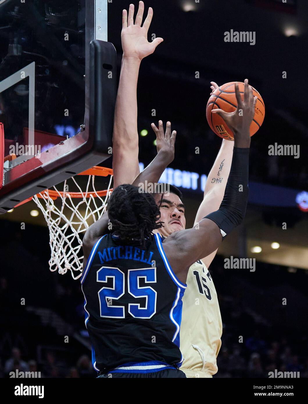 Purdue center Zach Edey, right, blocks a shot from Duke forward Mark Mitchell during the first ...
