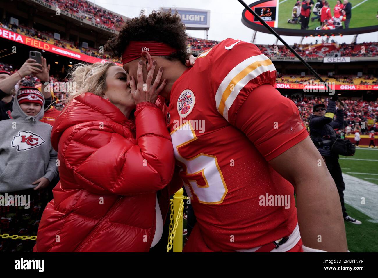 Kansas City Chiefs quarterback Patrick Mahomes (15) gets a kiss from ...