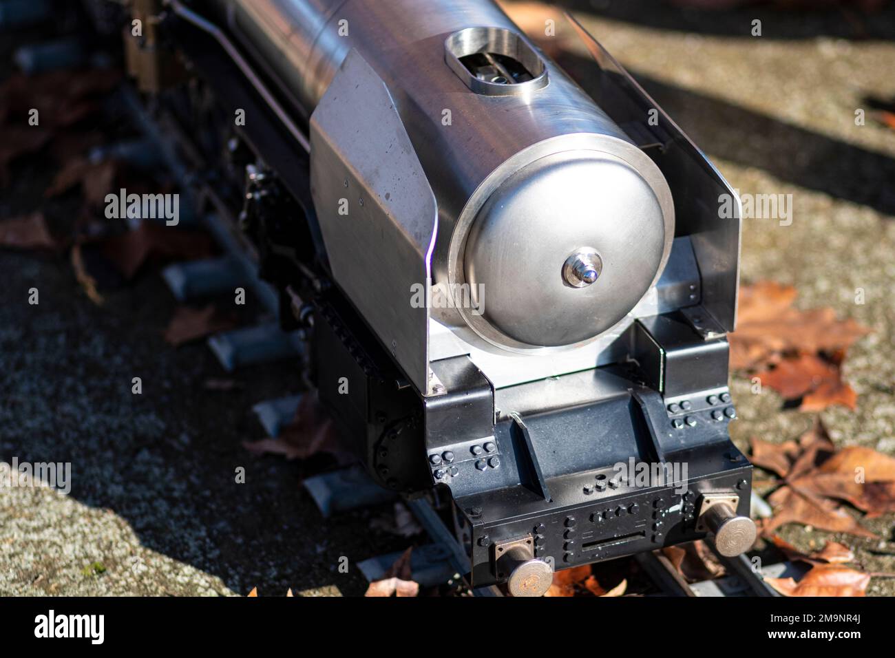Iron steam train close up still on a railway from high up point of view ...