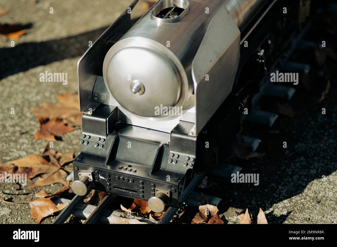 Iron steam train close up still on a railway from high up point of view ...