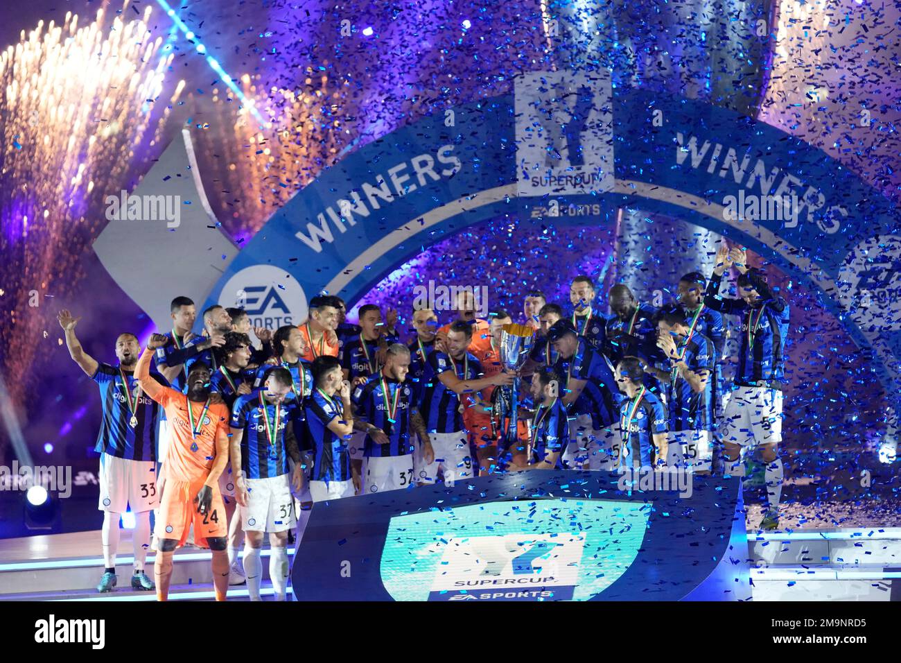 Inter Milan's players hold the trophy as they celebrate after winning ...